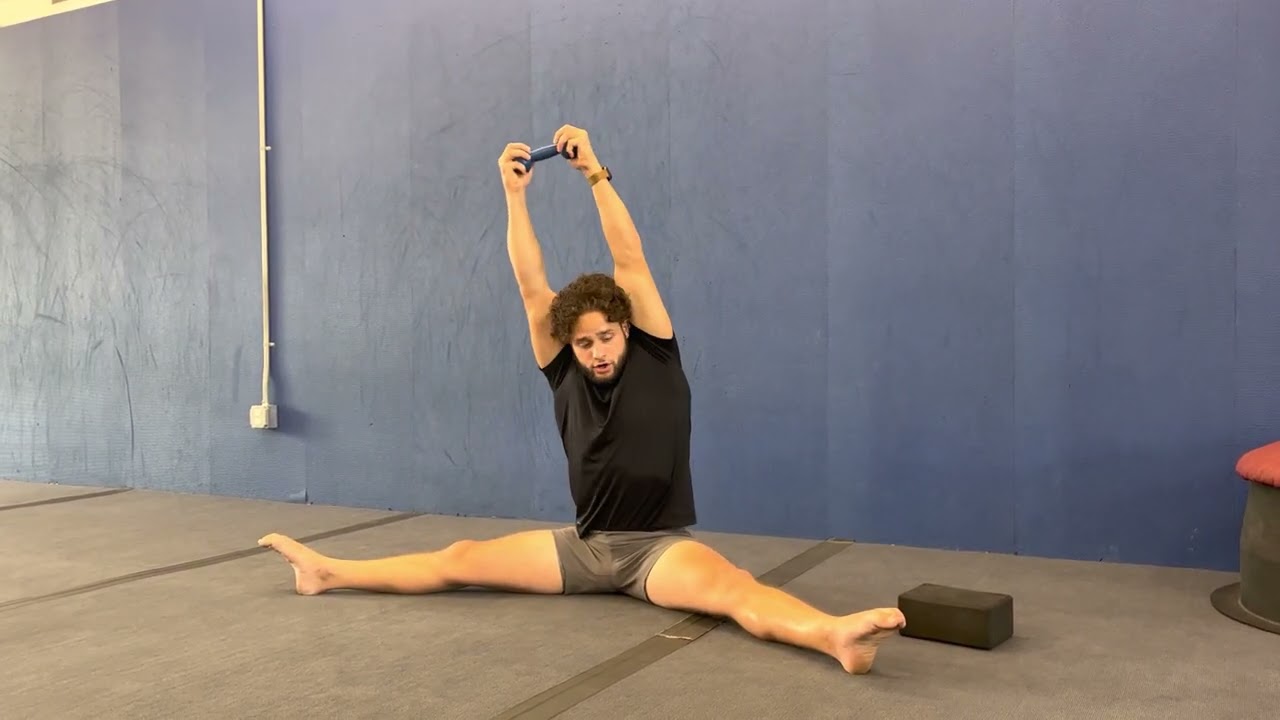 Weighted Seated Straddle Side to Side Bend