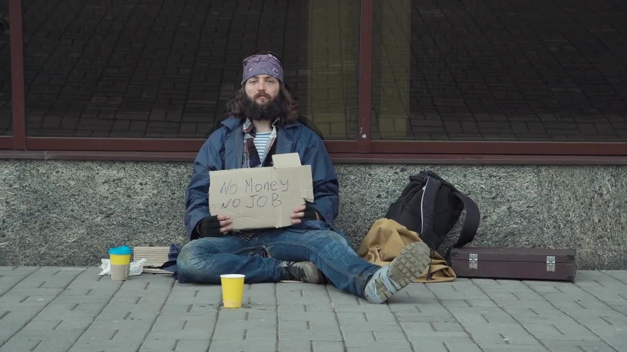 Homeless With Sign On Street Stock Video
