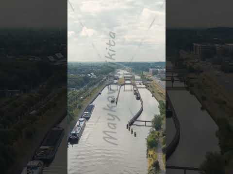 Vertical video. Ghent, Belgium. Ringvaart in Ghent - water channel. Sluis Merebeke - landmark, ga...