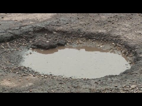 Streets riddled with potholes throughout Central Fresno, CA