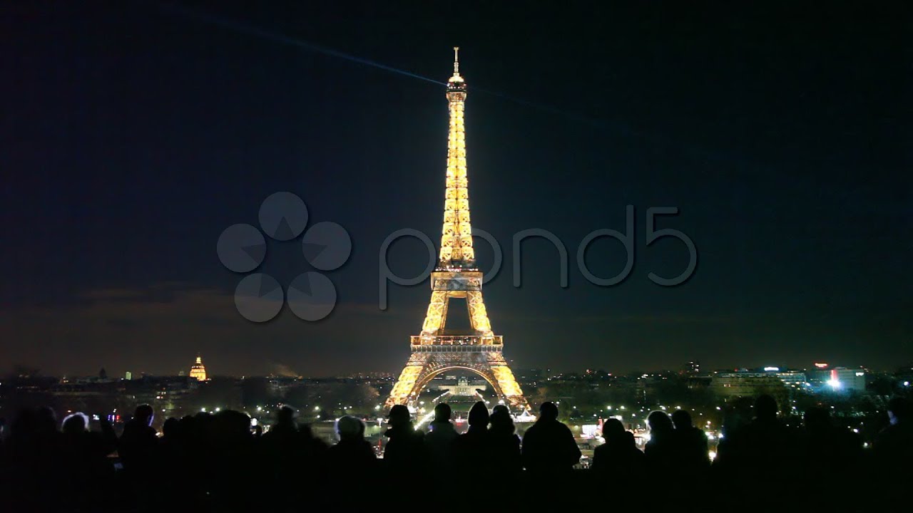 Night Eiffel Tower With Illumination And Searchlights, Paris, France.. Stock Footage