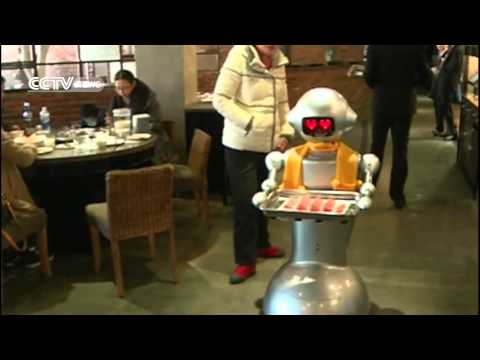 Watch this robot waiter attend to diners at a Chinese hot pot ...