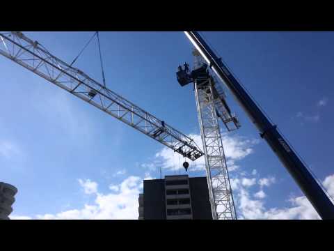 Final section long horizontal jib in real time Crane Assembly at The Modern on Burrard st