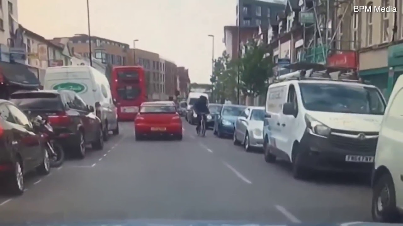 Shocking moment cyclist pulls knife on driver in fit of road rage