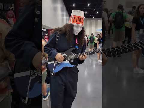 Bucket Head at San Diego Comic Con playing guitar