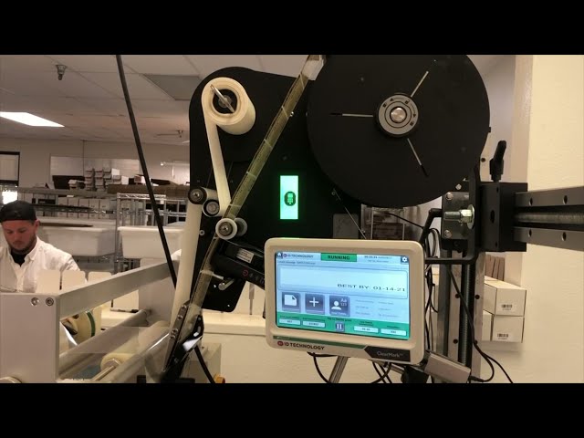 Model 252 Labeler - Printing and Applying Labels On Cartons of Water ...