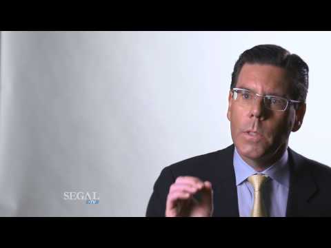 What is a structured settlement in a legal setting and how does it work with taxes?