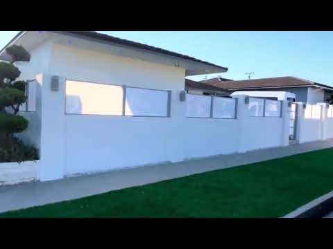 Smooth Plexiglass Wall Topper and Sliding Gate Installation | Modern Privacy by Globus Gates