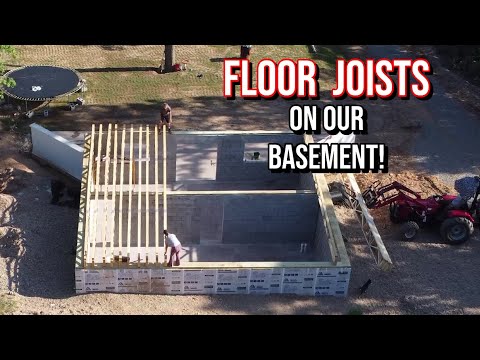 HUGE MILESTONE For Our Build! FLOOR JOISTS ARE UP! | Couple Builds Basement for Cabin in the Woods