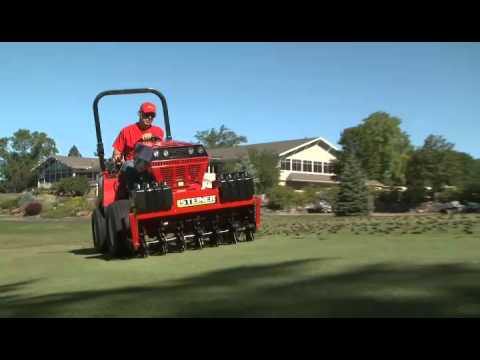 Steiner 440 Tractor with Core Aerator Attachment