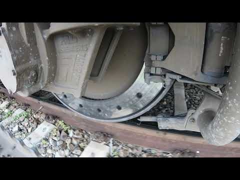 Siemens Vectron locomotive struggling to move a long train stuck in curves.
