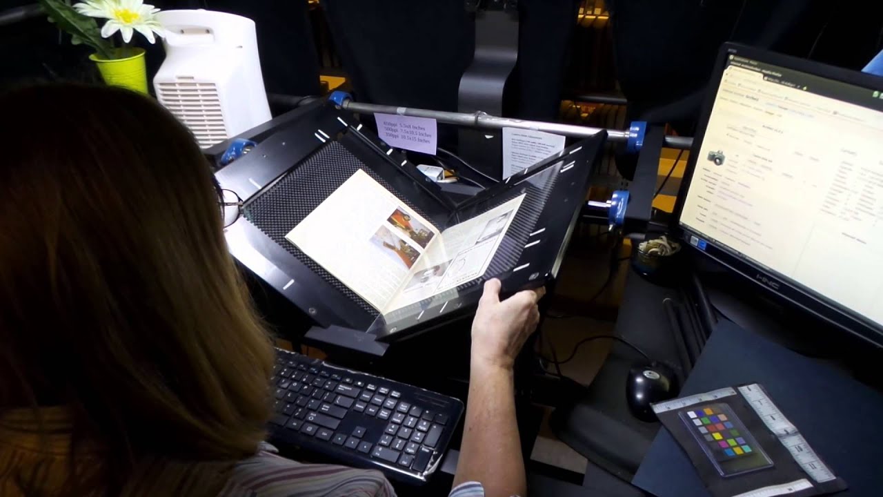 Internet Archive Scanning Center: LaDonna scanning an issue of Softalk magazine
