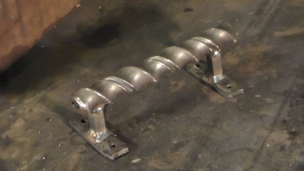 Door pull from a forged angle iron wrap