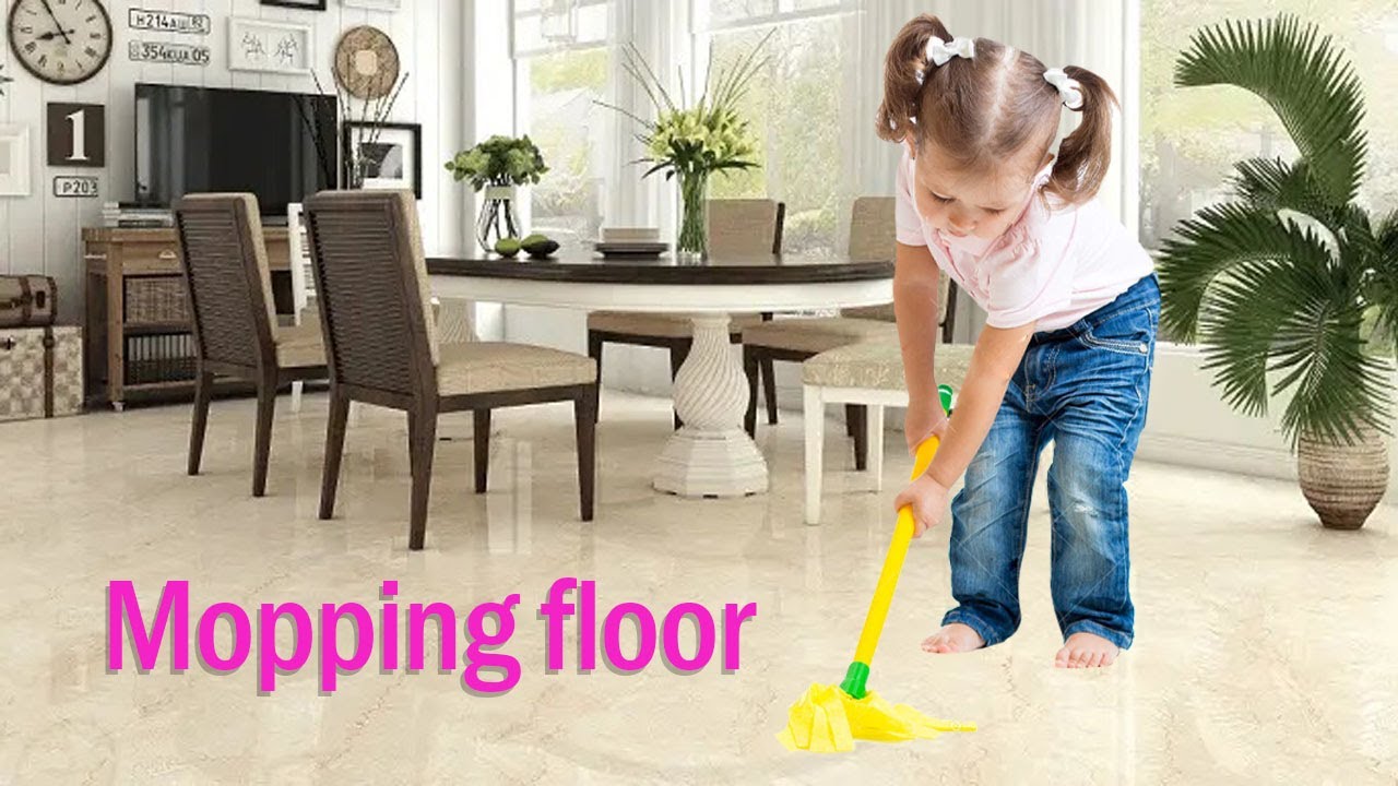 2 year old mopping floor - teach'em young...