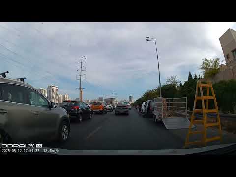 Tesla at the shoulders of a road gets or gives help from another car people
