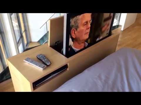 Tv cabinet with lift for end of bed. Pop up tv cabinet