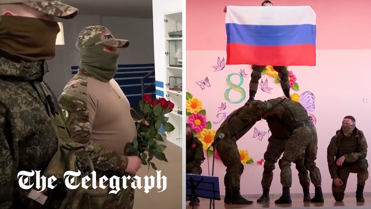Watch: Russian troops hand out flowers in occupied Ukraine on ...