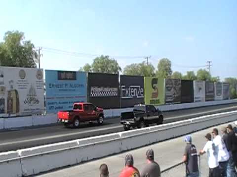 6.7 Liter Powerstroke Ford Vs. 6.6 Liter Duramax Chevy At Truclin' For Kids 2012