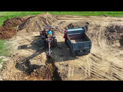 Case 580B backhoe leveling for post frame garage. Almost 2' from the low to high point