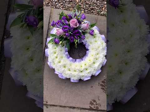 Creating a funeral wreath based in white double chrysanthemums #funeralflowers #flowers #floristry
