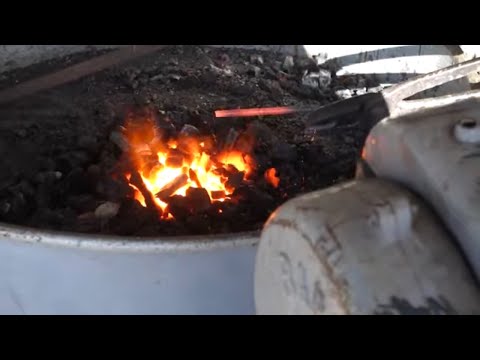 Blacksmith forging a hook