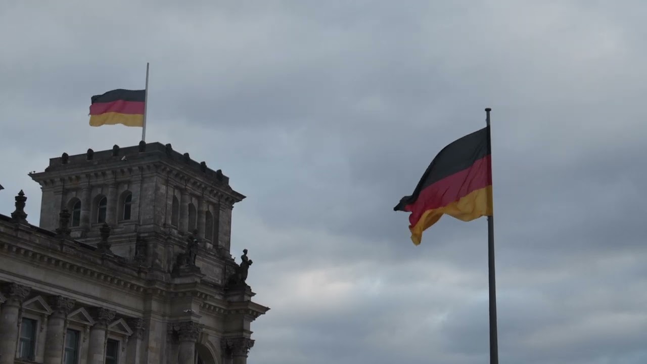 GERMAN FLAGS BY THE REICHSTAG BUILDING IN GERMANY 4K