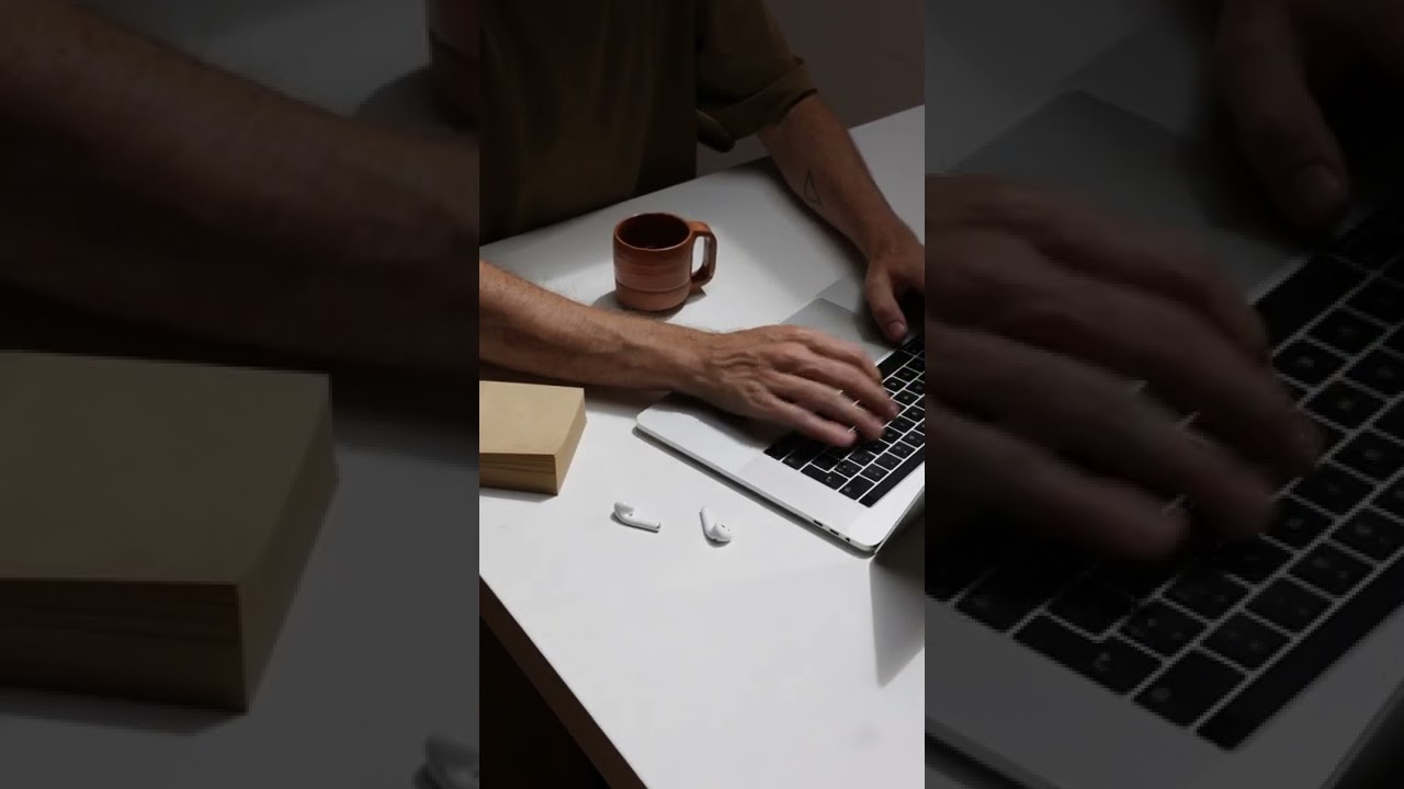 Stock Video: High Angle Shot of a Man Using a Laptop