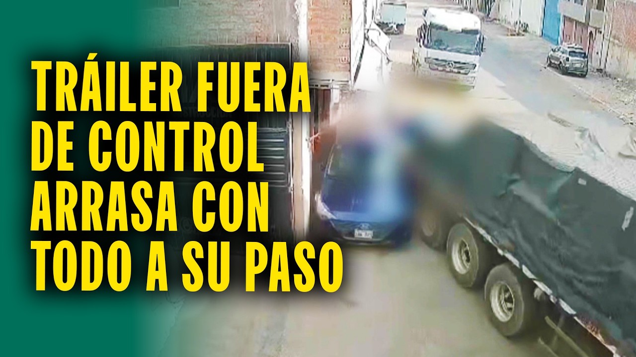 Tráiler fuera de control choca contra varios carros y queda aplastado en la pared