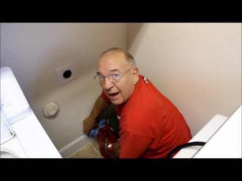Blow lint out of dryer vent pipe with leaf blower