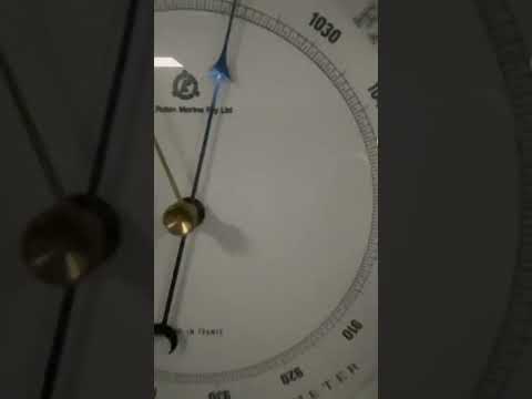 How do you use a barometer to check atmospheric pressure?