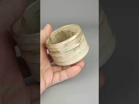 140ml stoneware teacup with wavy texture & Shino glaze. allinteaceramics.etsy.com