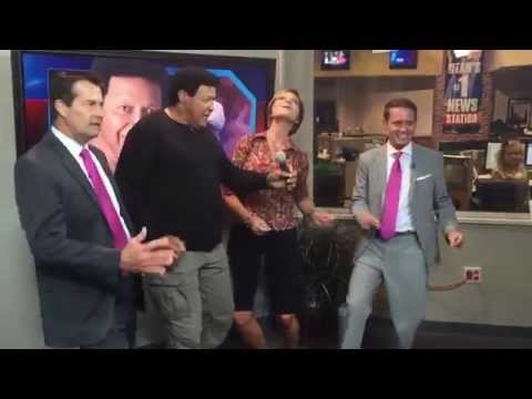 Chubby Checker does "The Twist" with Utah TV station anchors