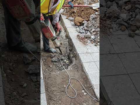 The process of crushing concrete with a percussion drill. Good tools to help you work