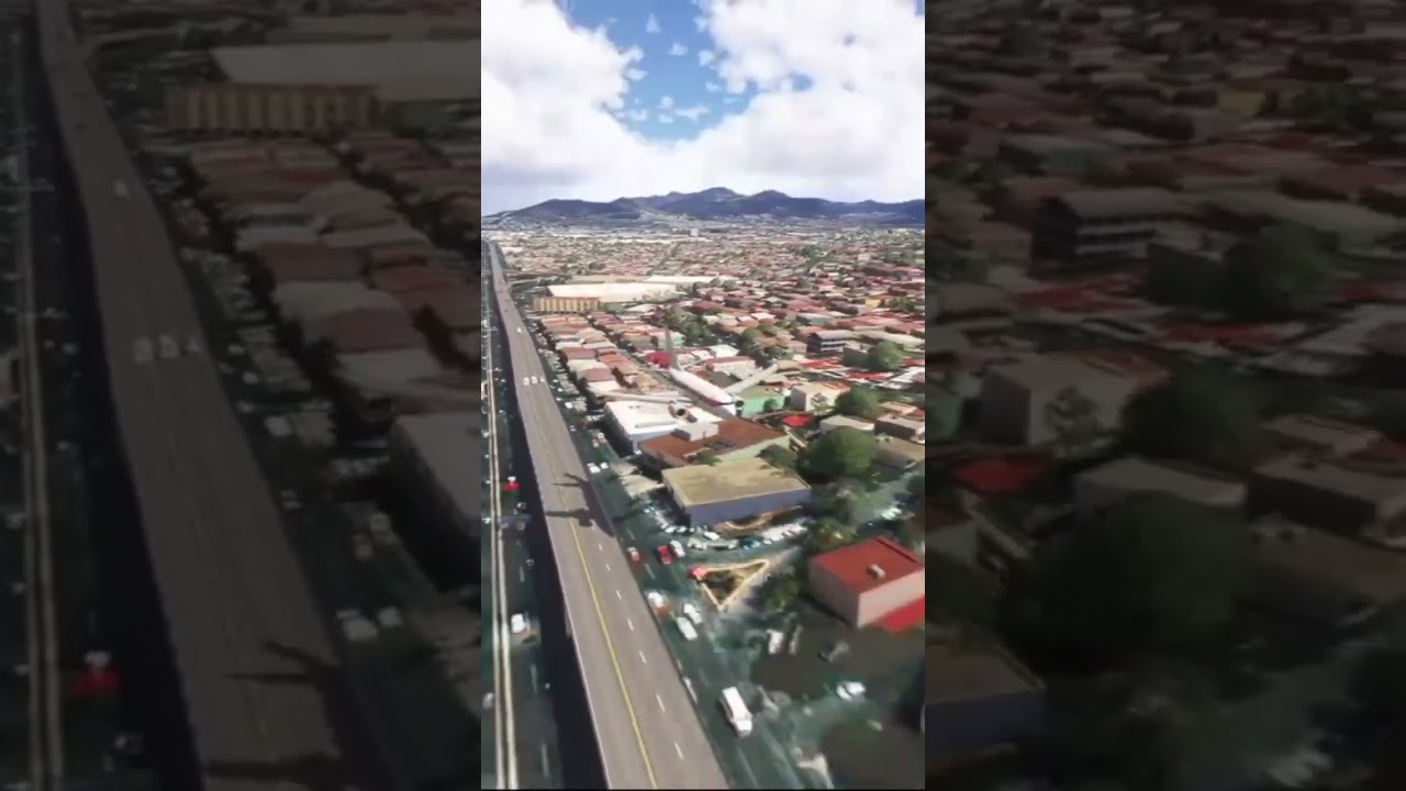 Airplane Soaring Over a Massive Urban Network #cityscapes #flying #shorts