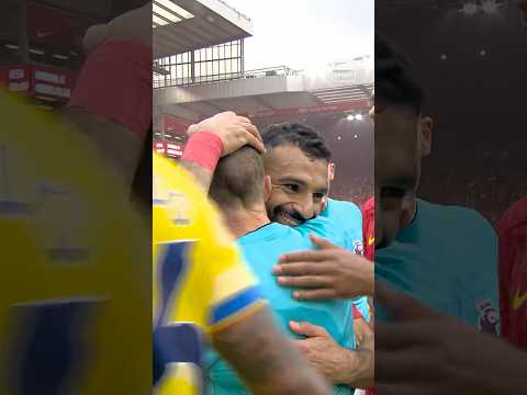 Mohamed Salah embraces retiring offical Derek Eaton as he hangs up the whistle ????