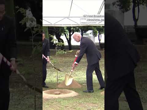 Joe Biden and Emmanuel Macron plant a tree