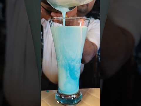 Blue Hawaiian Punch "Mocktail" :- Pineapple Juice + Coconut Syrup + Blue Curacao Syrup