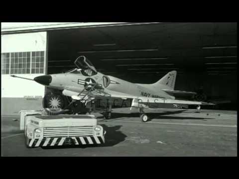 US Navy F4H Phantom and A4D-2 Skyhawk aircraft take off from a runway at Anacosti...HD Stock Footage