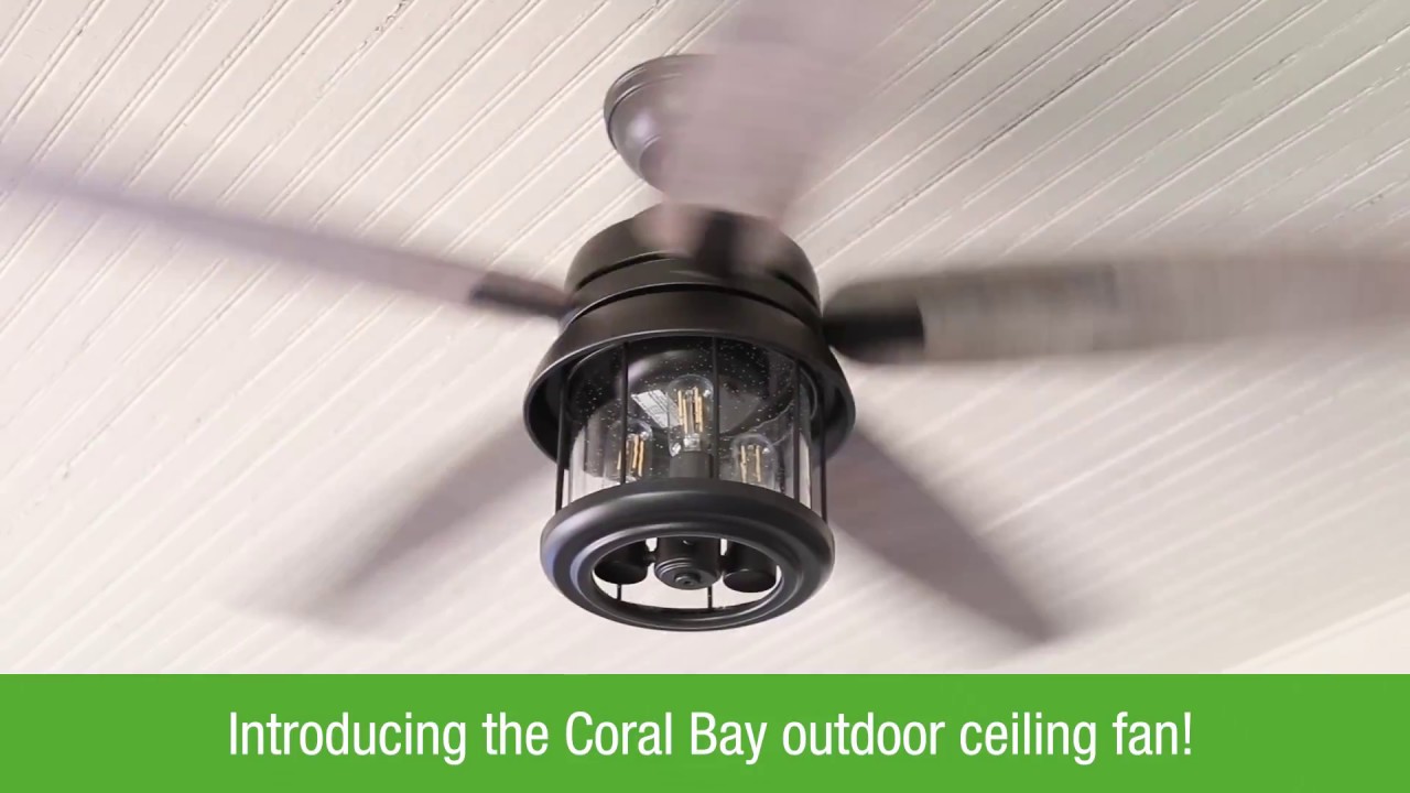 Rustic patio design featuring the Coral Bay lantern outdoor ceiling fan