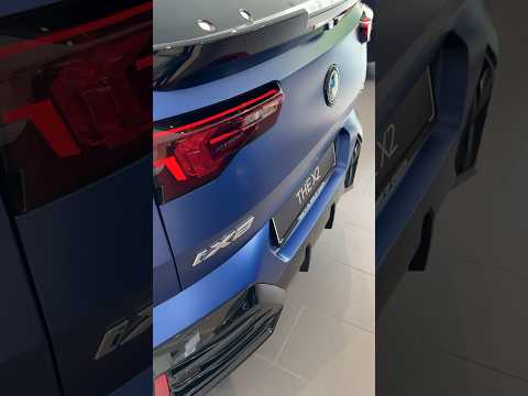 The all-new BMW iX2 in Frozen Portimao Blue metallic