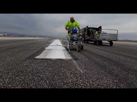 Line Painting in Action on a Runway in Macedonia