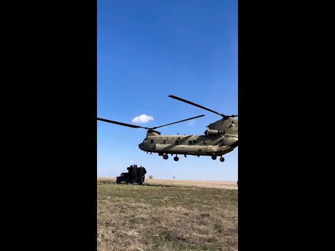 Pop Quiz: How does this Chinook get this equipment moved?