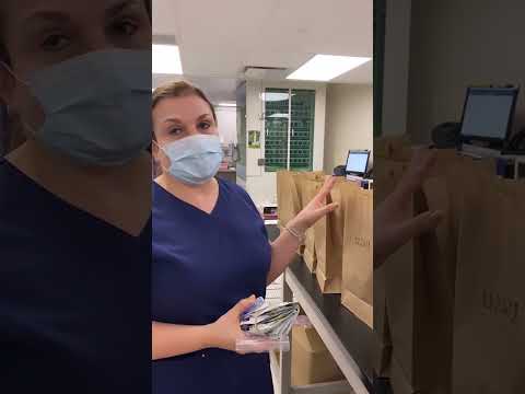 Pharmacy Tech Lisa packs a medication order for Freeport Campus
