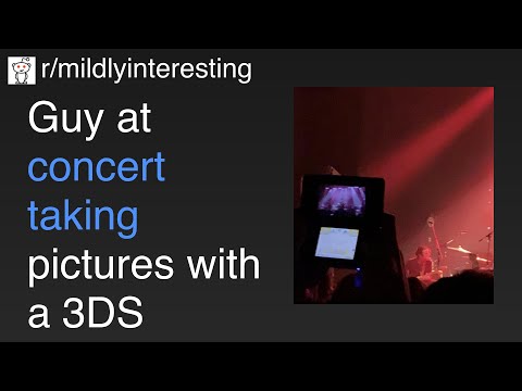 Guy at concert taking pictures with a 3DS