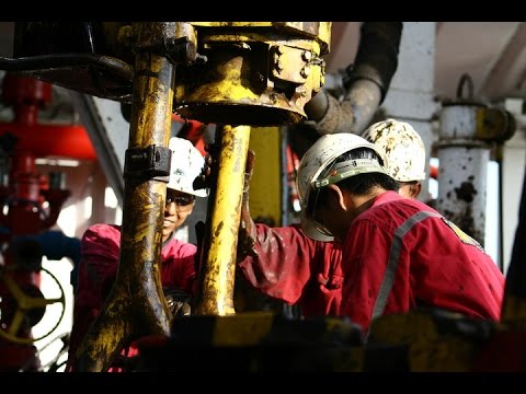 Photograph: Working on Swamp Barge Rig - Episode II