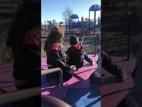 All 4 kids on playground SPIN thing at once! Who can stay on longest?!:):) so fast! #shorts