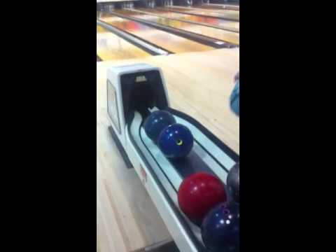 Jai Bellamy bowling with a towel