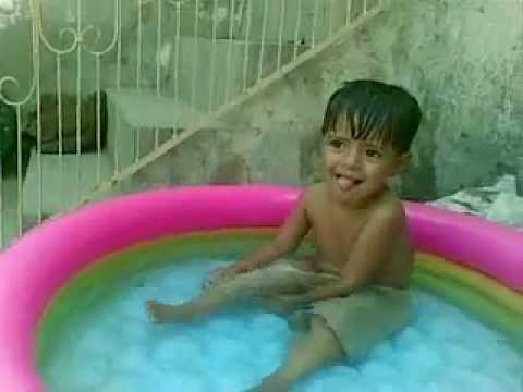 Cute child taking bath in water tub- 2015