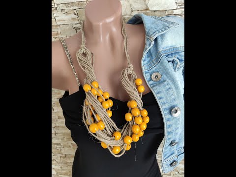 My necklace is made of wood beads and linen yarn On Etsy