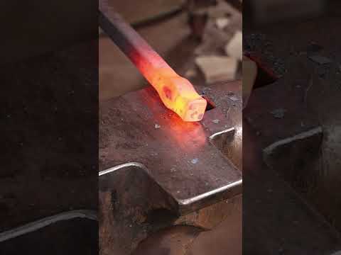 How a blacksmith punches a hole in hot iron